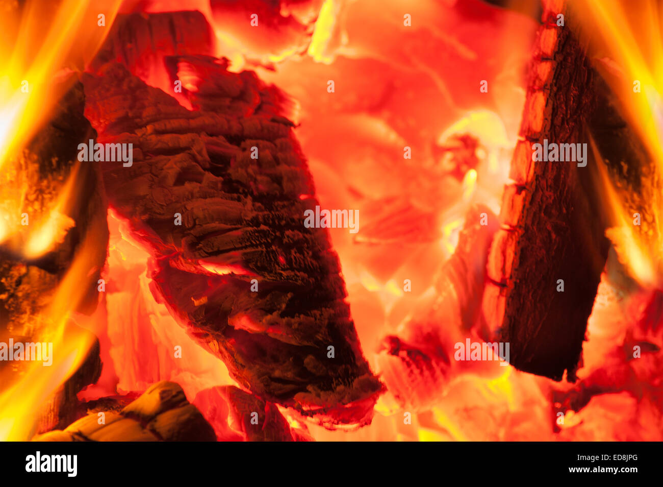 Warmly glow of a traditional winter scene as the open fire in a home ...