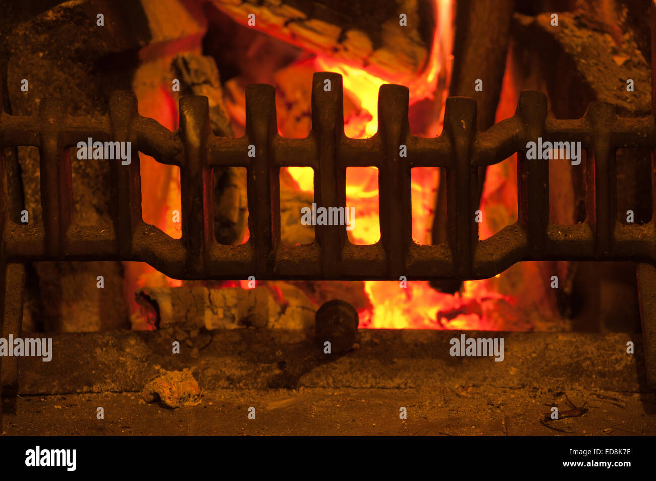 Warmly glow of a traditional winter scene as the open fire in a home ...