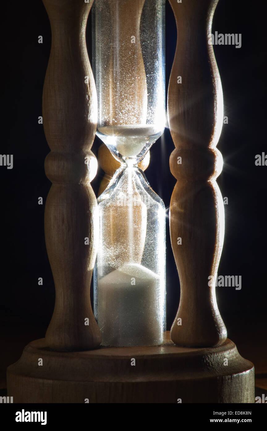 timer hourglass streaming grains of sand flowing through depicting ...