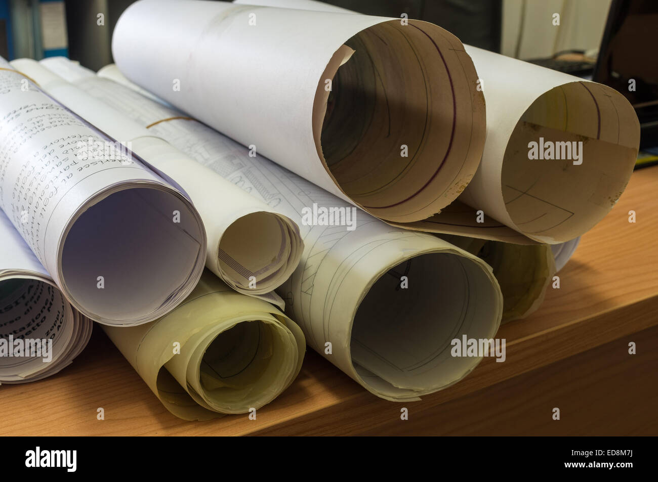 Rolls of paper on the desk of an architect Stock Photo - Alamy