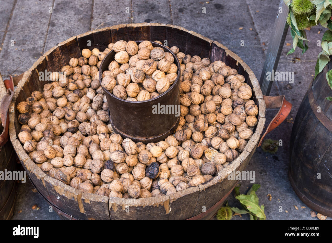 Walnuts in a wooden barrel and a metal scoop Stock Photo - Alamy