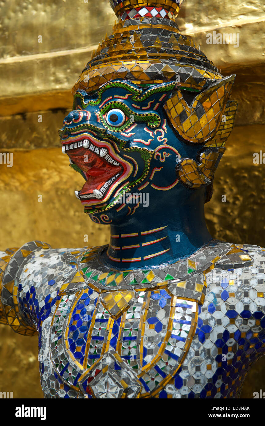 Decorative monkey demon yaksha statue at a golden phra chedi in the ...