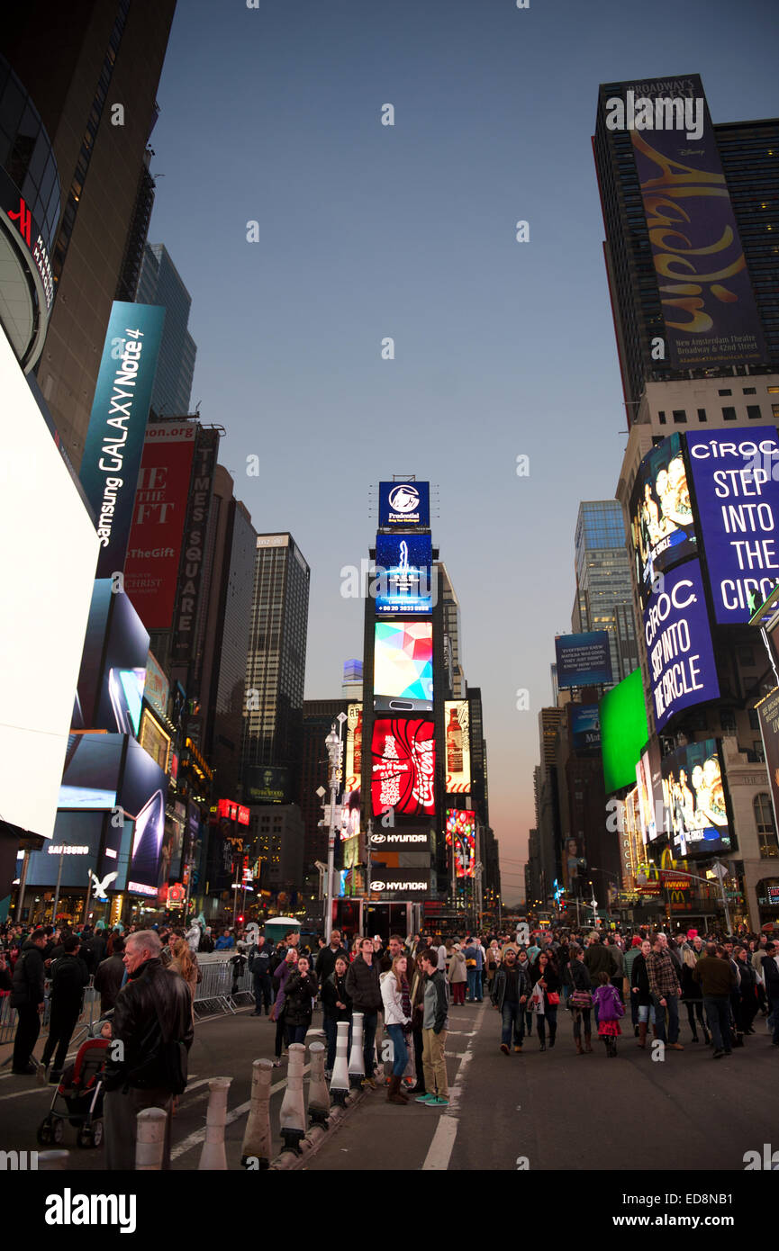 NEW YORK, USA - DECEMBER 27, 2014: The lights of Times Square draw ...