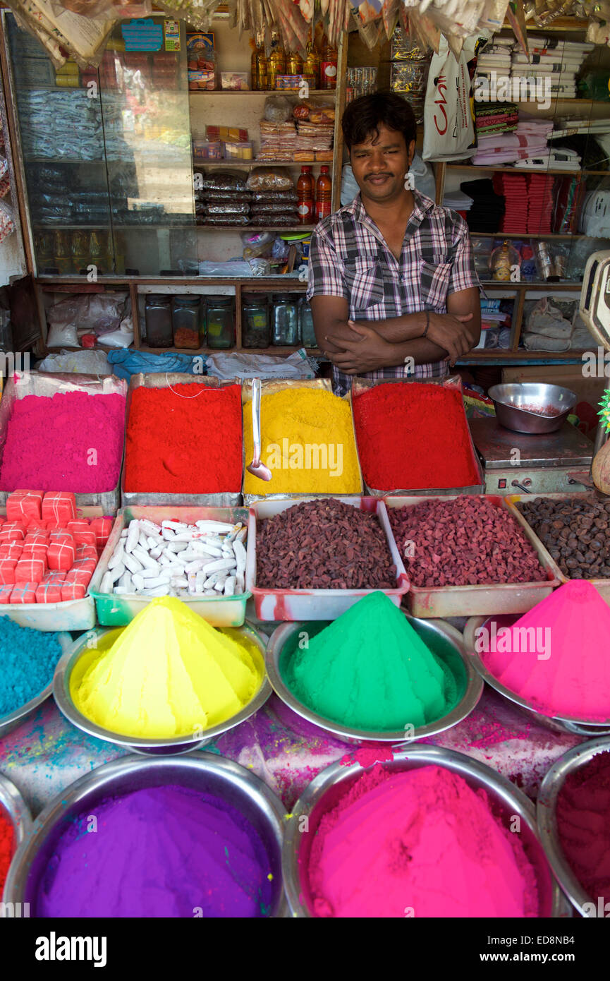 MYSORE, INDIA - NOVEMBER 4, 2012: Young Indian vendor stands behind ...