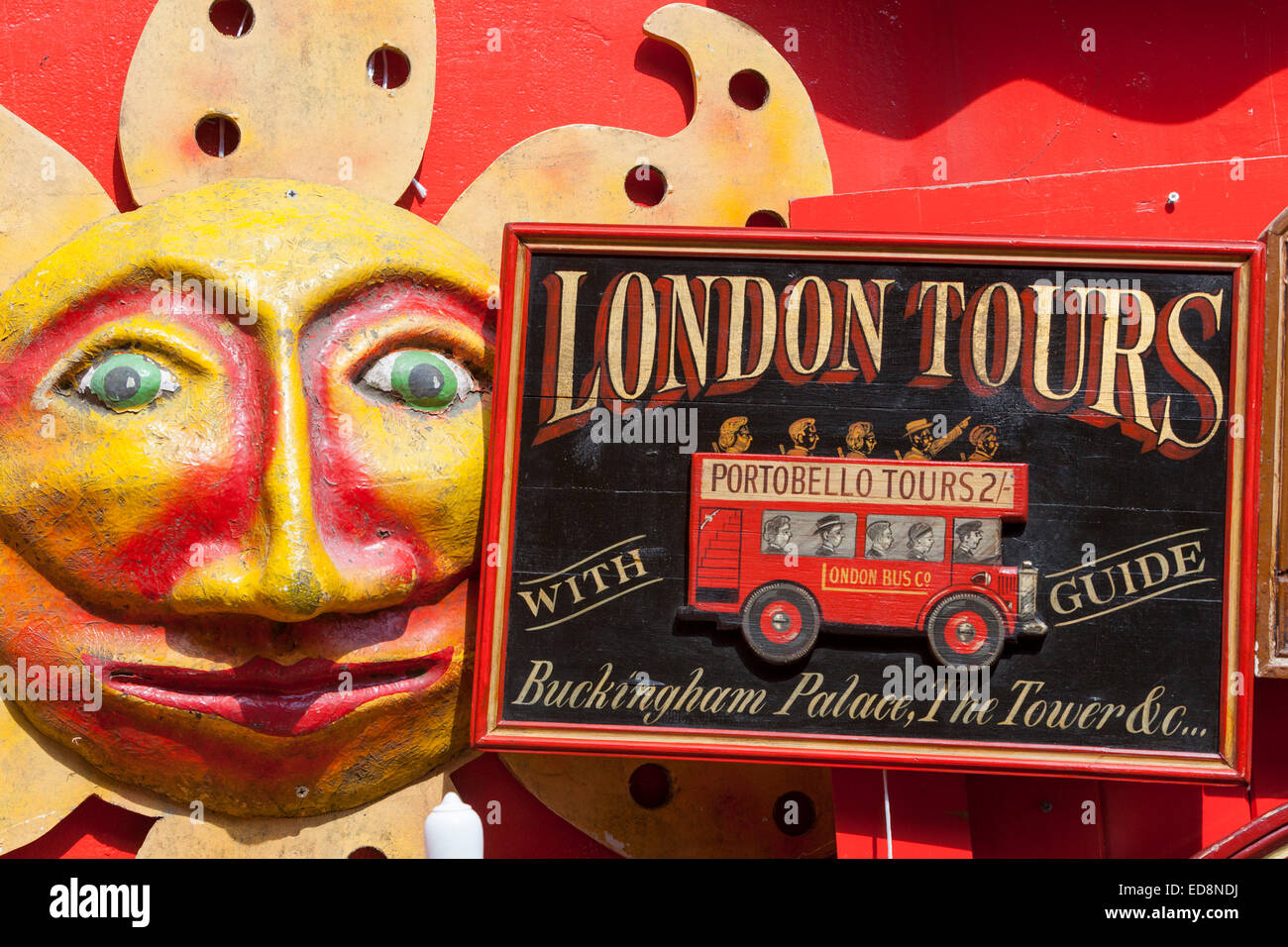 A London Tours sign and a giant yellow sun, façade of Alice's shop in ...
