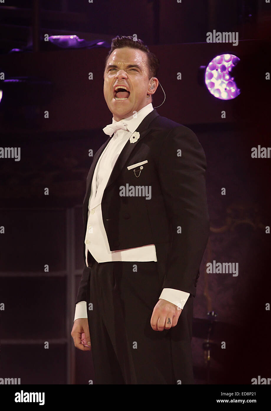 Robbie Williams performing live on stage at the Manchester Phones4U ...