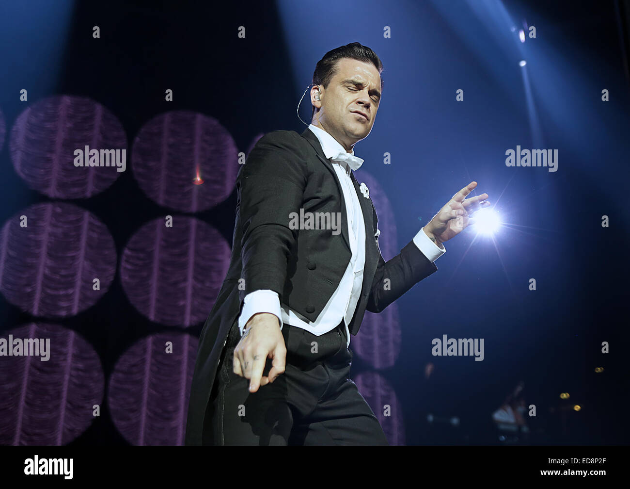 Robbie Williams performing live on stage at the Manchester Phones4U ...