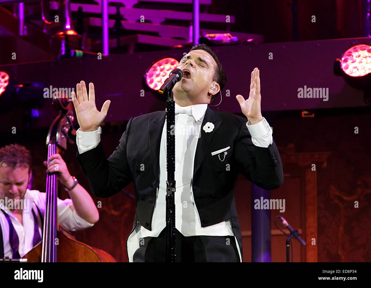 Robbie Williams performing live on stage at the Manchester Phones4U ...