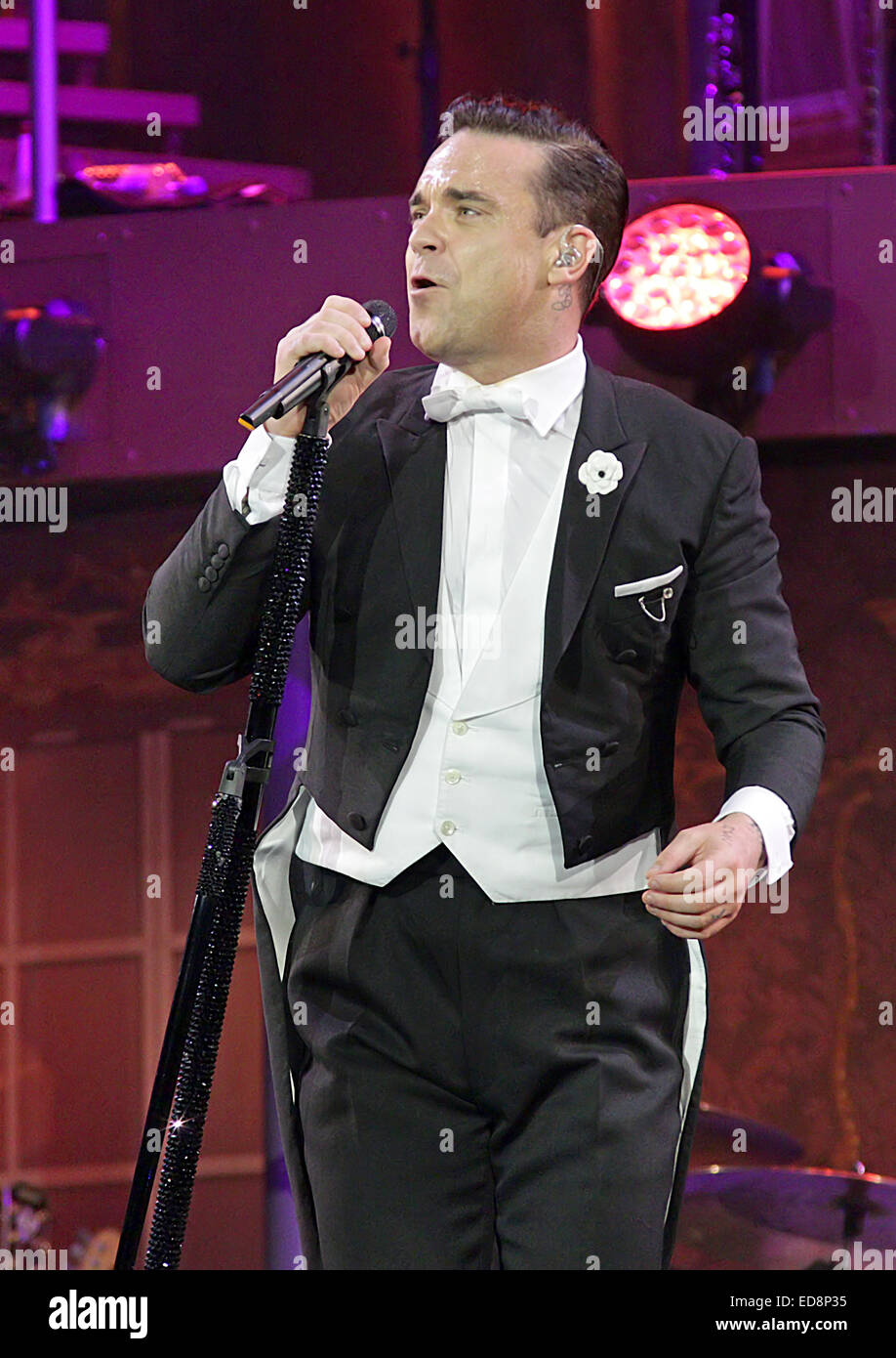Robbie Williams performing live on stage at the Manchester Phones4U ...