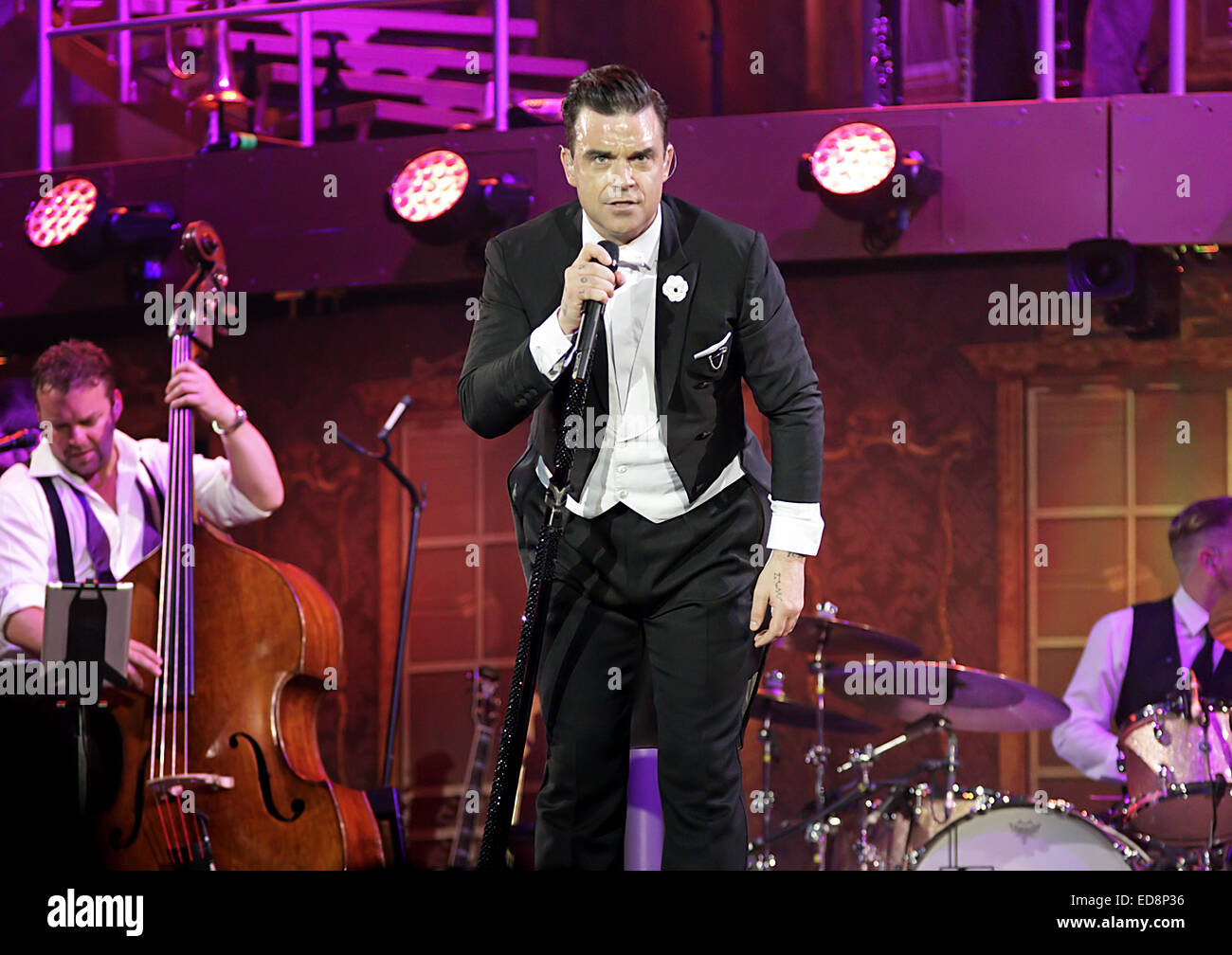 Robbie Williams performing live on stage at the Manchester Phones4U ...