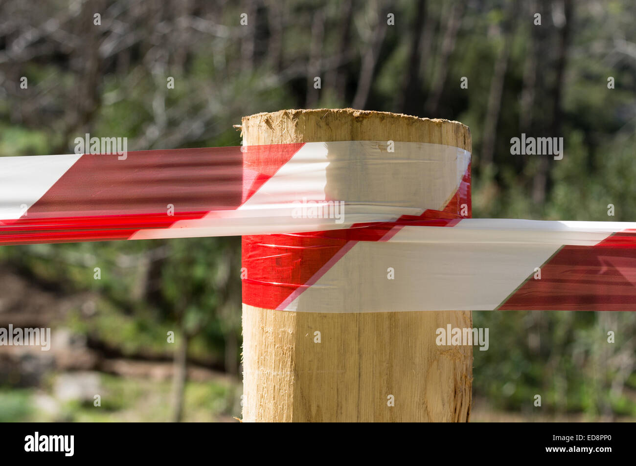 Warning tape attached to a wooden pole and used as a parapet Stock ...