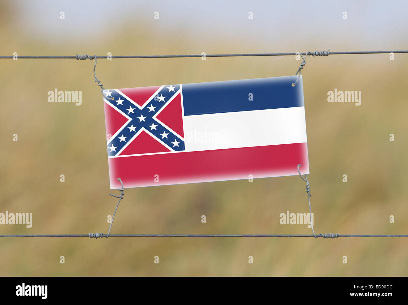 Border fence - Old plastic sign with a flag - Mississippi Stock Photo ...