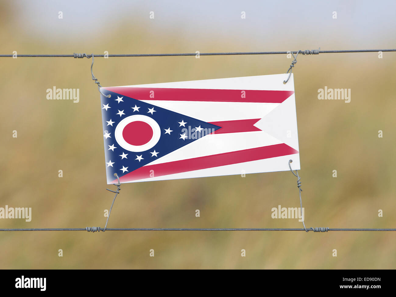 Border fence - Old plastic sign with a flag - Ohio Stock Photo - Alamy