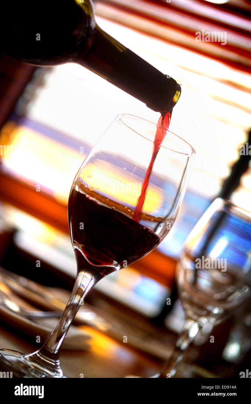 Red wine being poured in a restaurant Stock Photo - Alamy