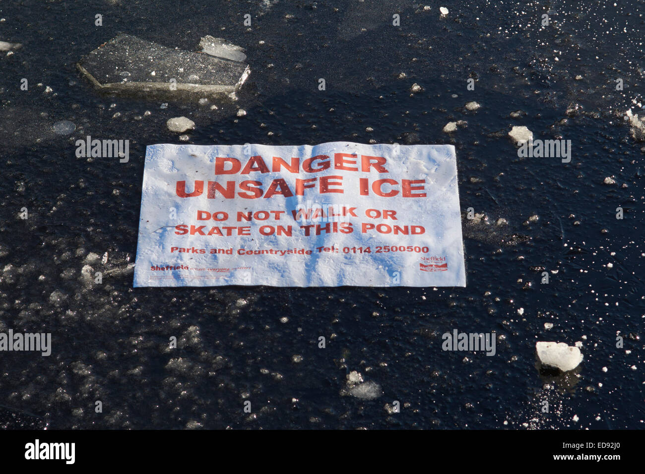 Danger unsafe Ice Notice on frozen pond - Sheffield, England, UK Stock ...