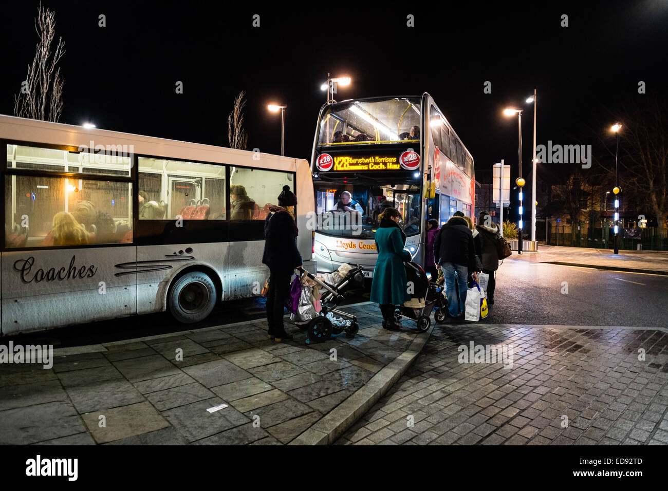 People catching public transport single and double decker buses from ...