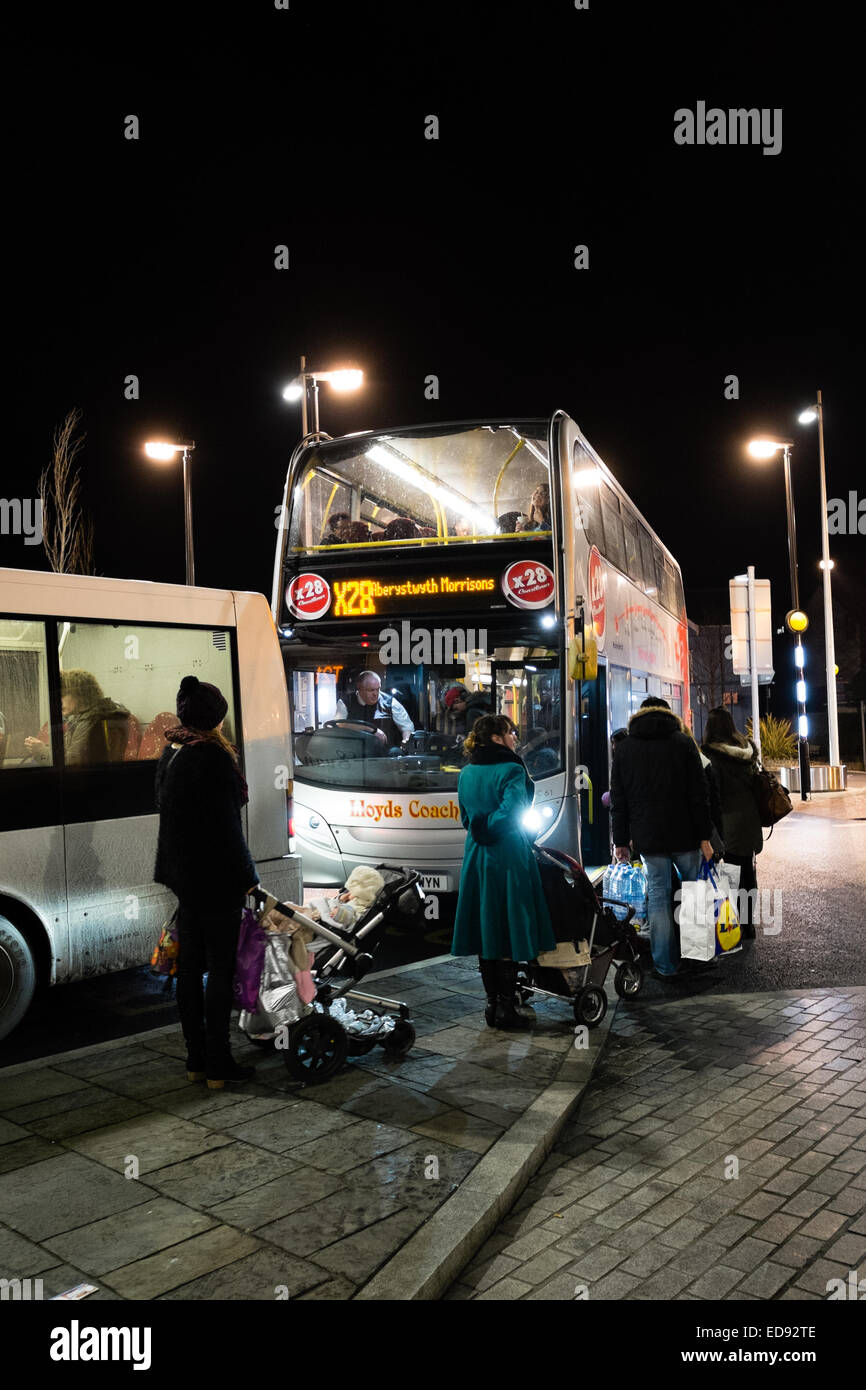 People catching public transport single and double decker buses from ...