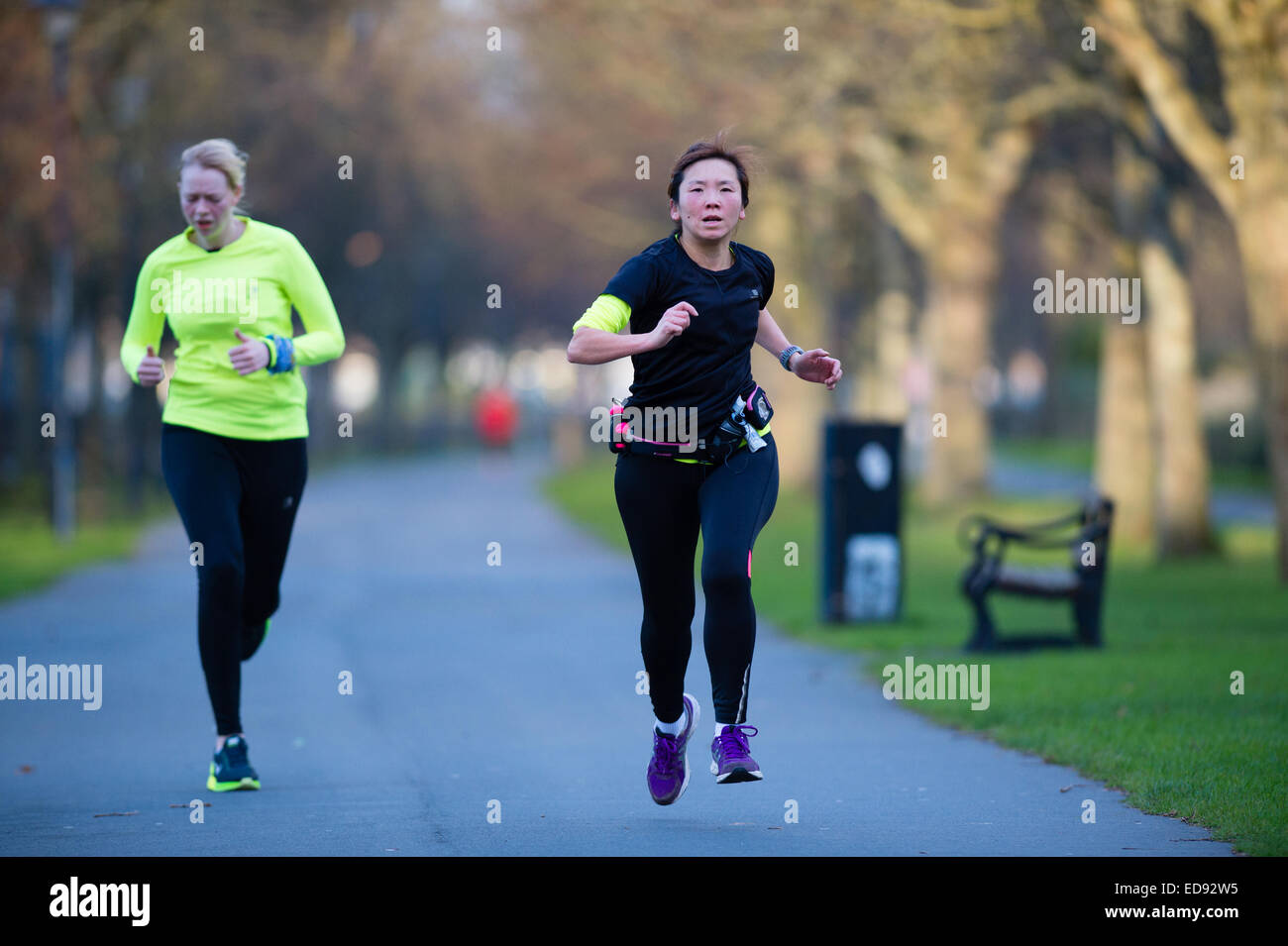 Two women runners taking part in the Aberystwyth 5K Park Run, Plascrug ...