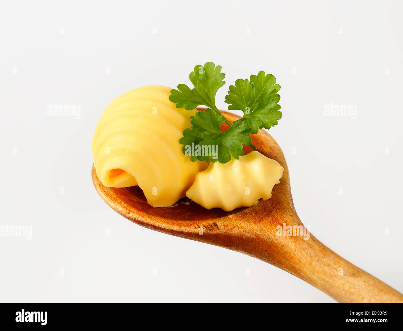 Butter curls on wooden spoon Stock Photo - Alamy