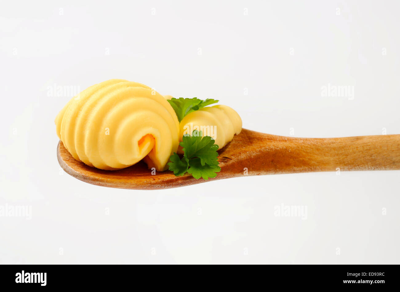 Butter curls on wooden spoon Stock Photo - Alamy