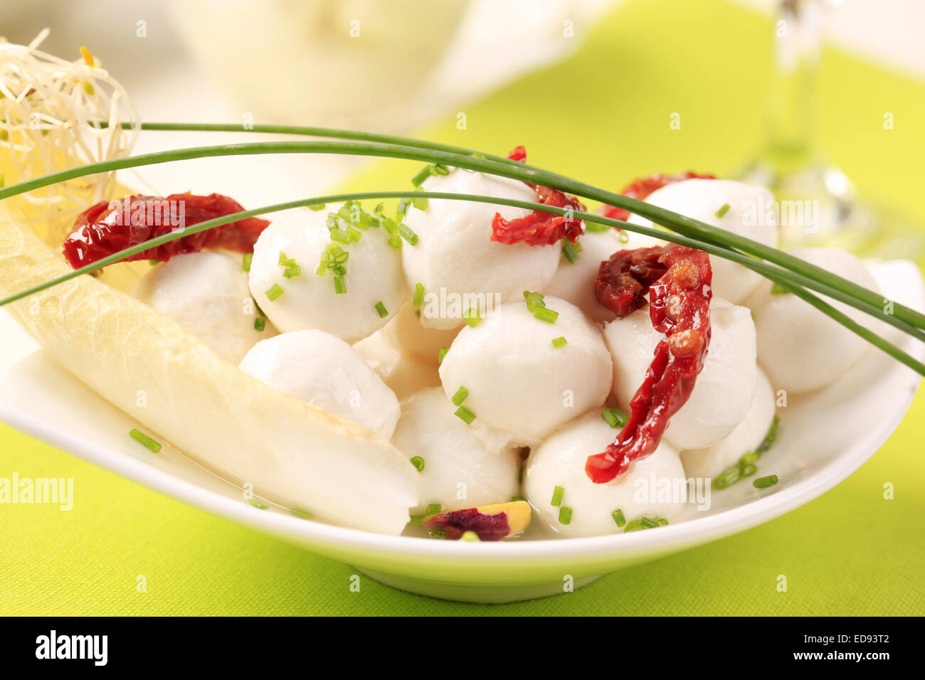 Mozzarella cheese balls and sun dried tomato Stock Photo - Alamy