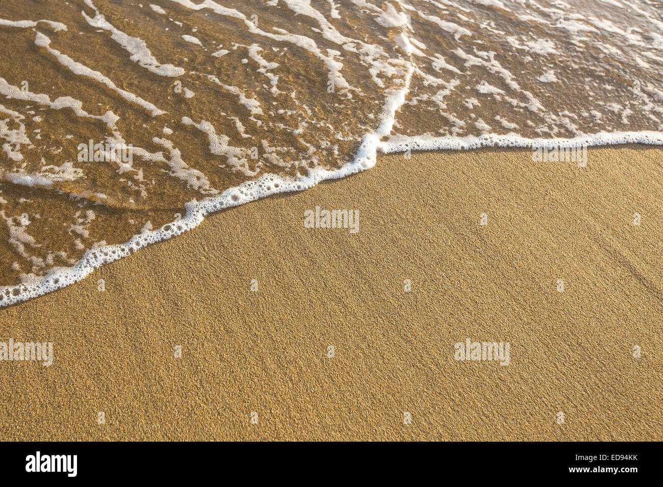 Soft surf on the beach, texture of the sand and water Stock Photo - Alamy
