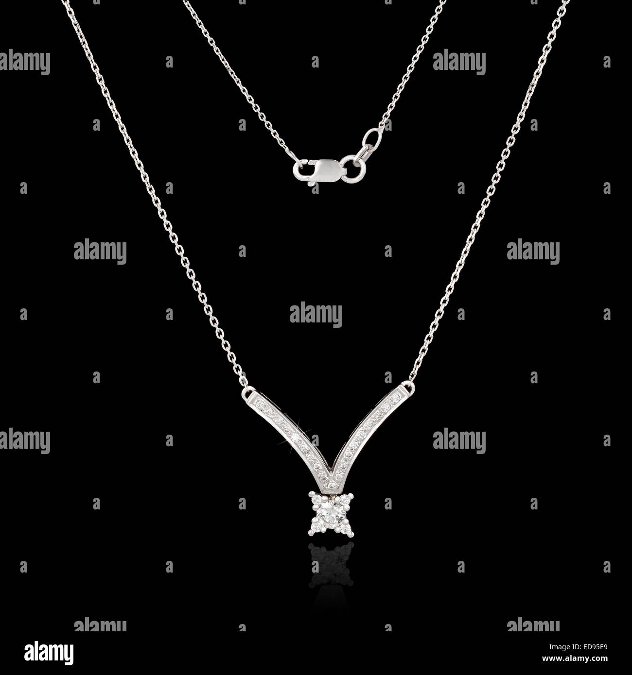 White gold necklace with diamonds isolated on black background Stock ...