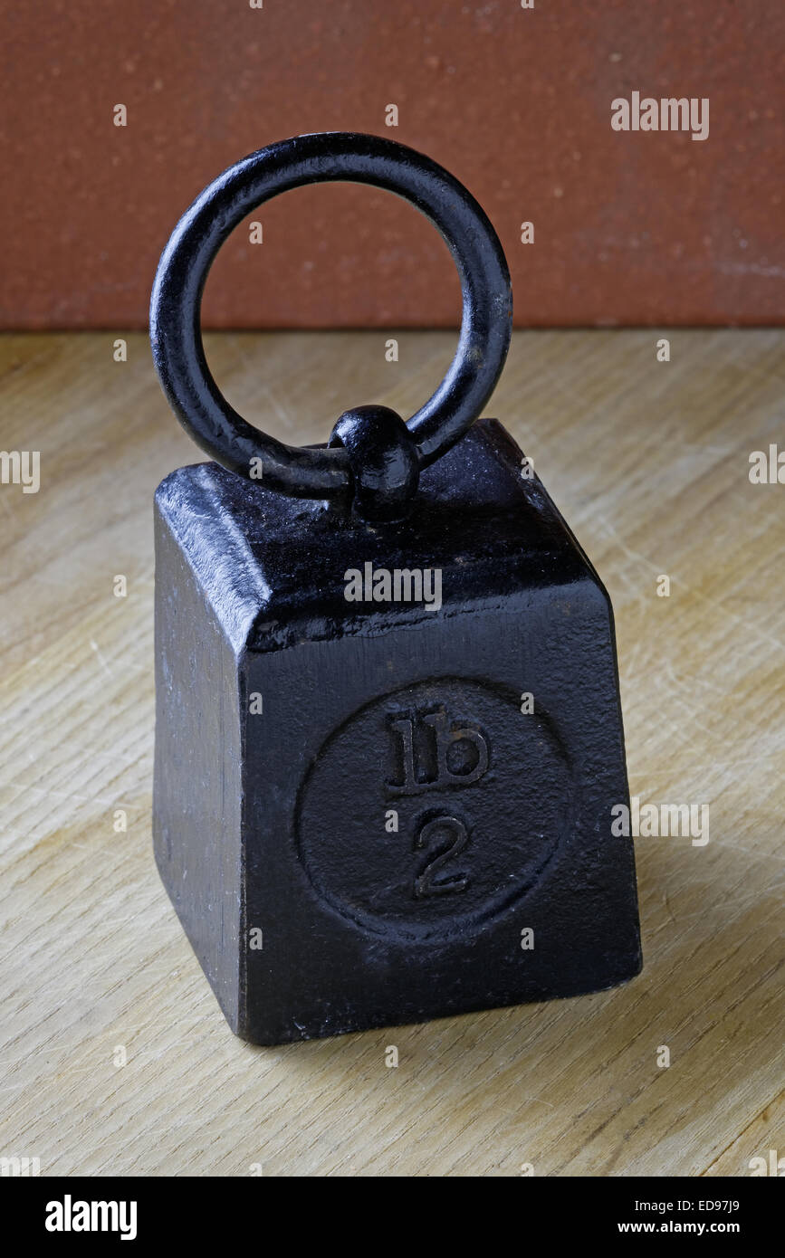 Close up of an antique 2 pound weight. Measurement concept Stock Photo ...