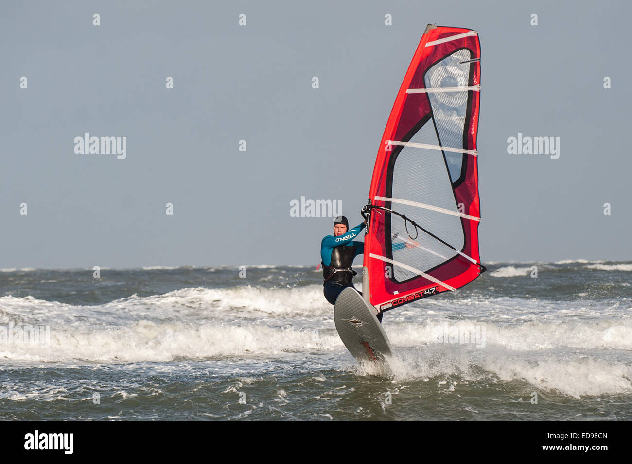 A windsurfer takes a wave at the beach of Norderney, Germany, 2 January ...