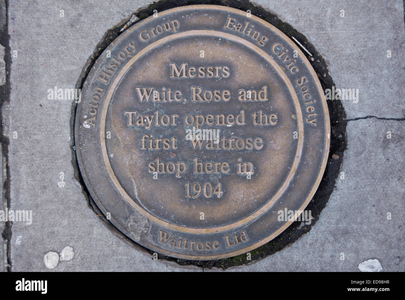 pavement plaque marking the site of the first waitrose shop, from 1904 ...