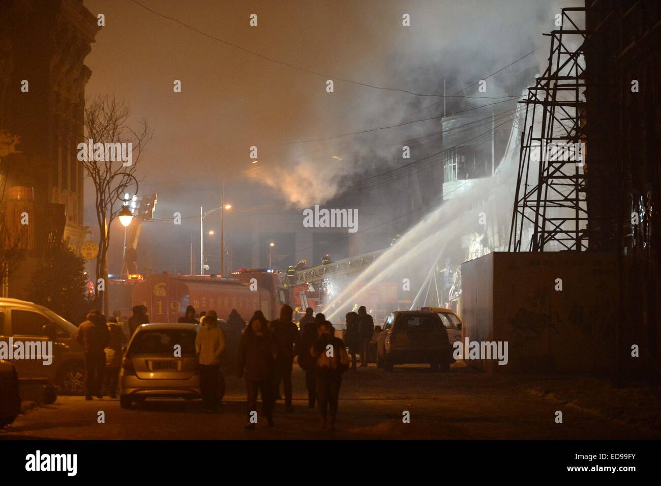 Harbin, China's Heilongjiang Province. 3rd Jan, 2015. Rescuers work on ...