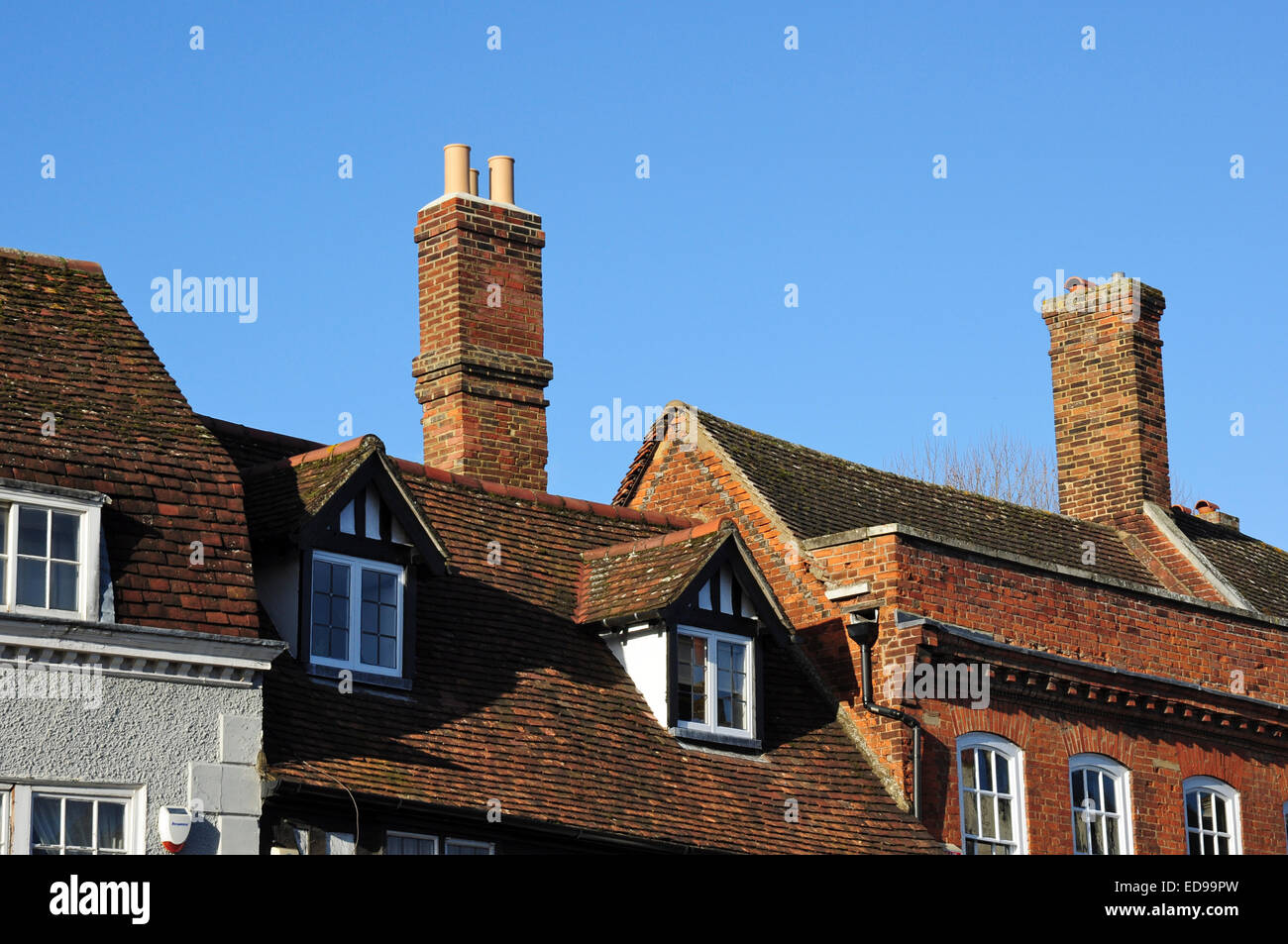 Tiled roofs and chimney stacks on old buildings, Hitchin, Hertfordshire ...