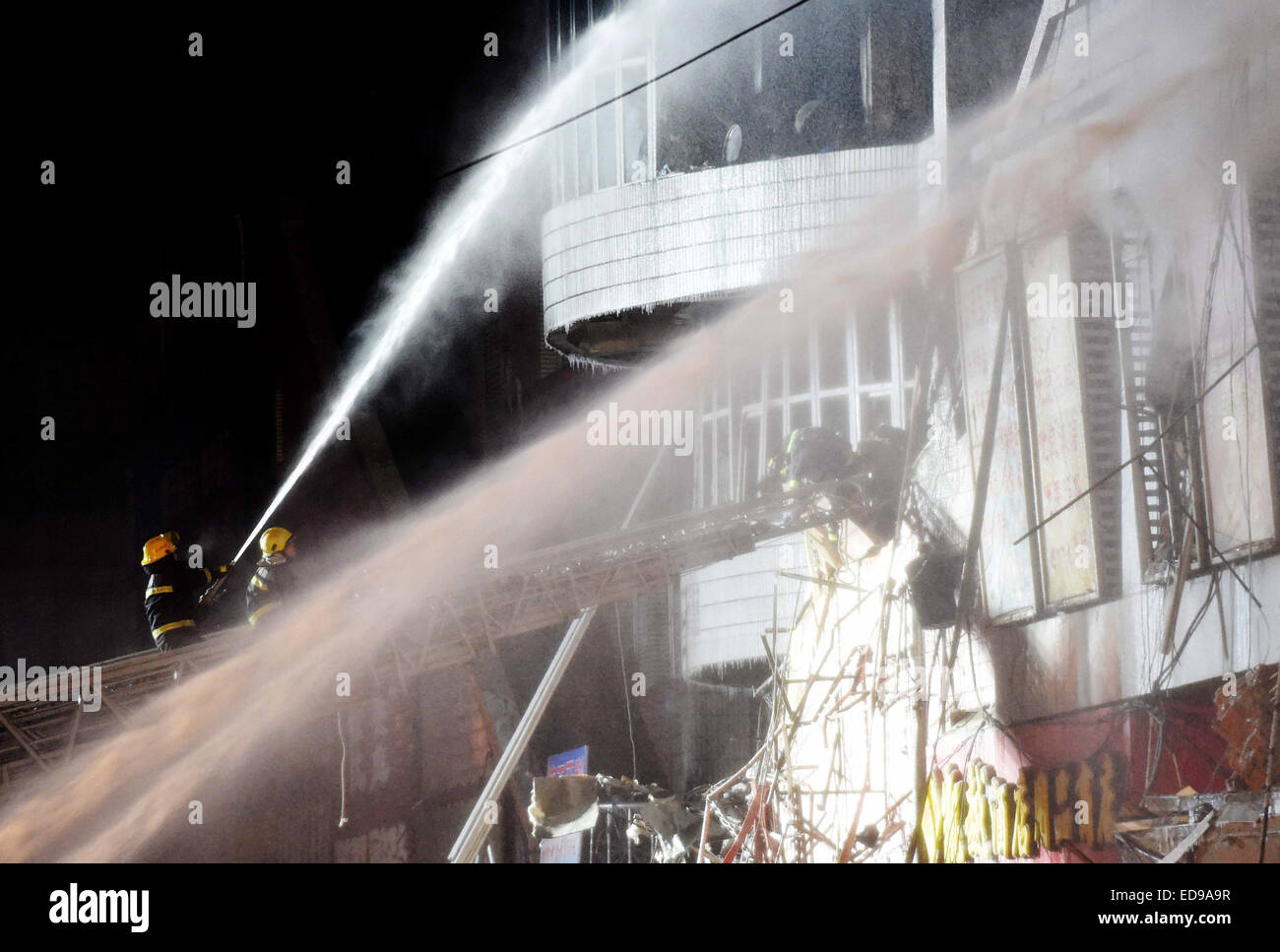 Harbin, China's Heilongjiang Province. 2nd Jan, 2015. Rescuers work on ...