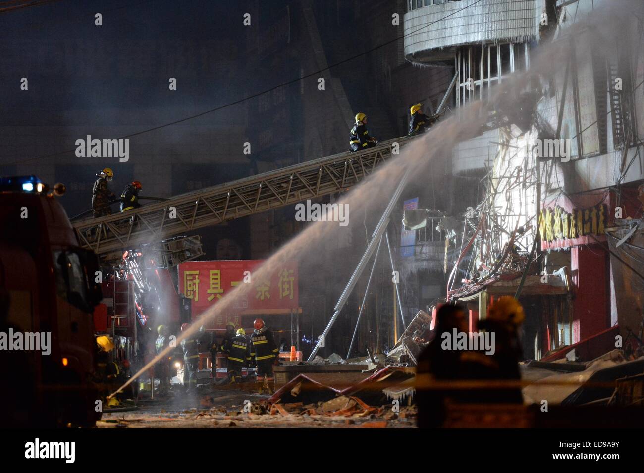 Harbin, China's Heilongjiang Province. 3rd Jan, 2015. Rescuers work on ...