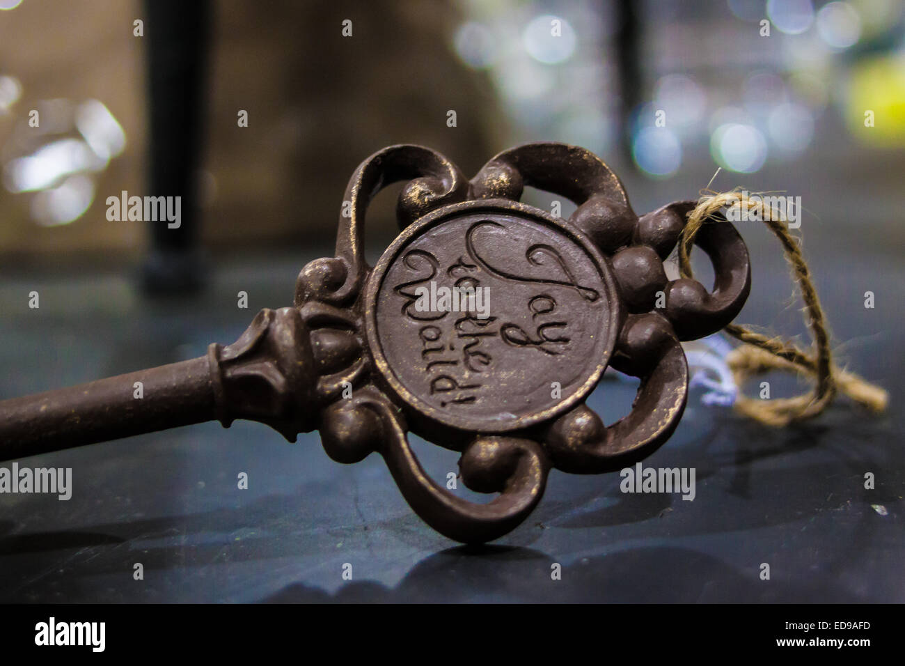 An engraved key on a black tabletop Stock Photo - Alamy