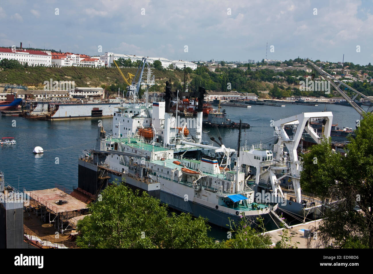 Military ship in port of town Sevastopol in region Crimea on Black sea ...