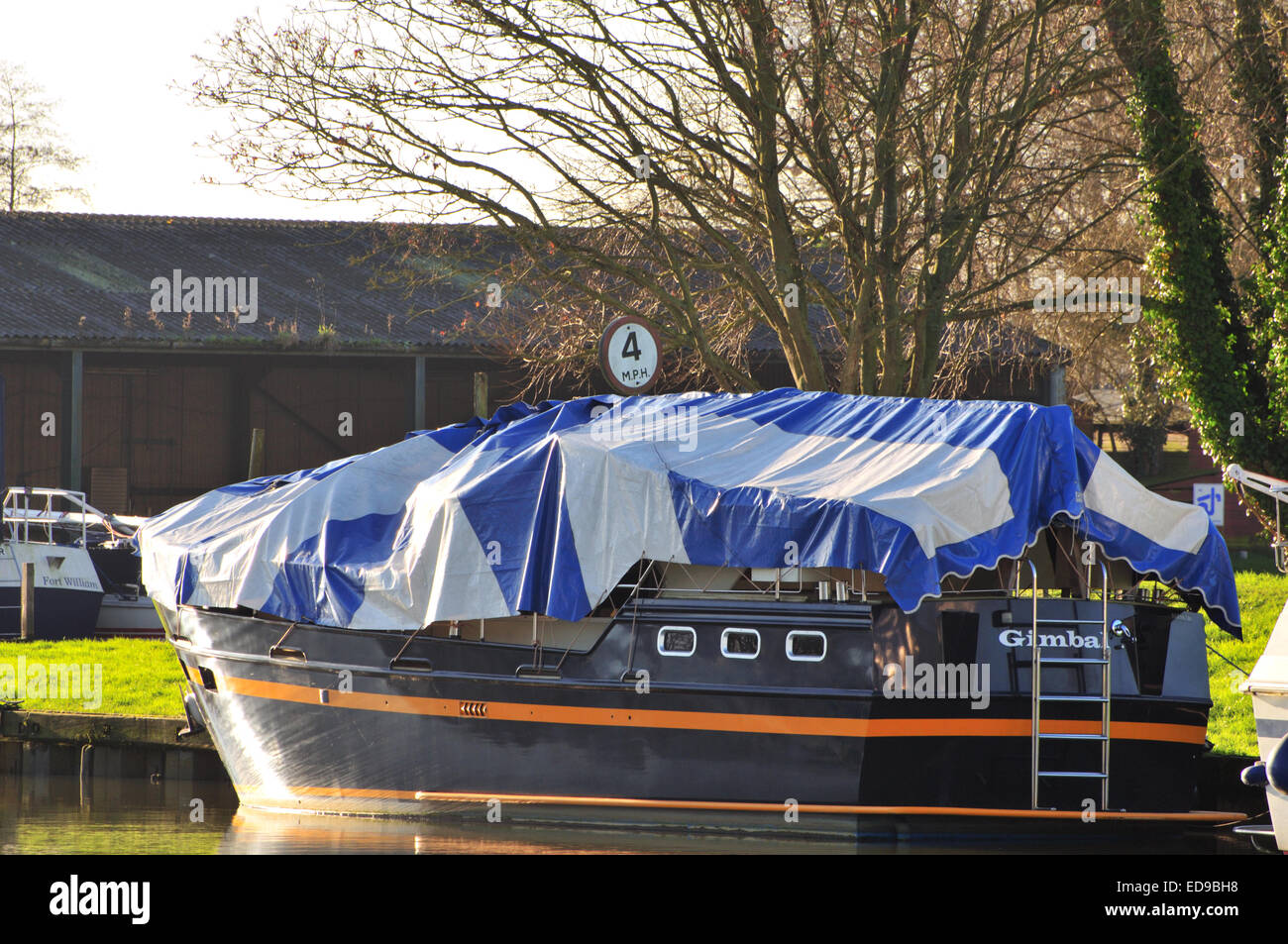 Boat covered by awning at Beccles Quay Stock Photo - Alamy
