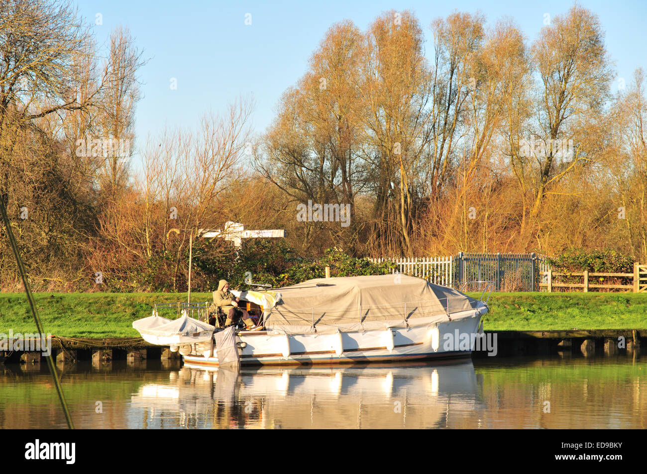 Man fishing from a boat at Beccles Quay Stock Photo - Alamy