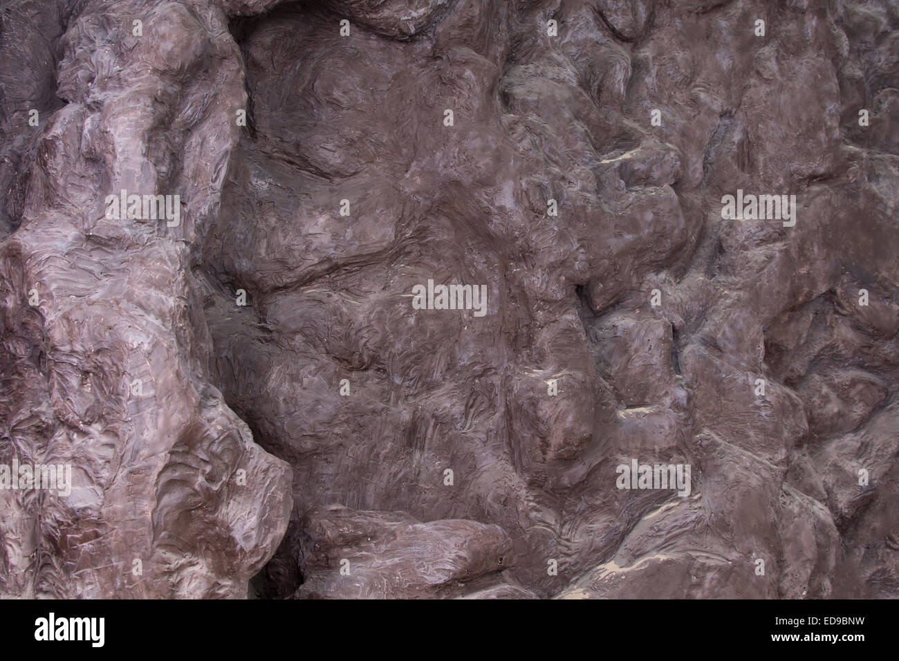 Background texture of rough grey fake rocks in a display or exhibit ...