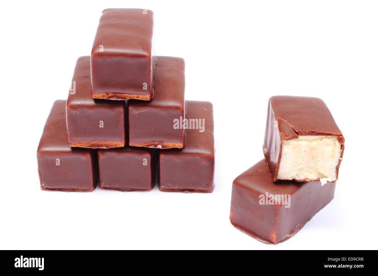 Stack of chocolate sweets isolated on white background Stock Photo - Alamy