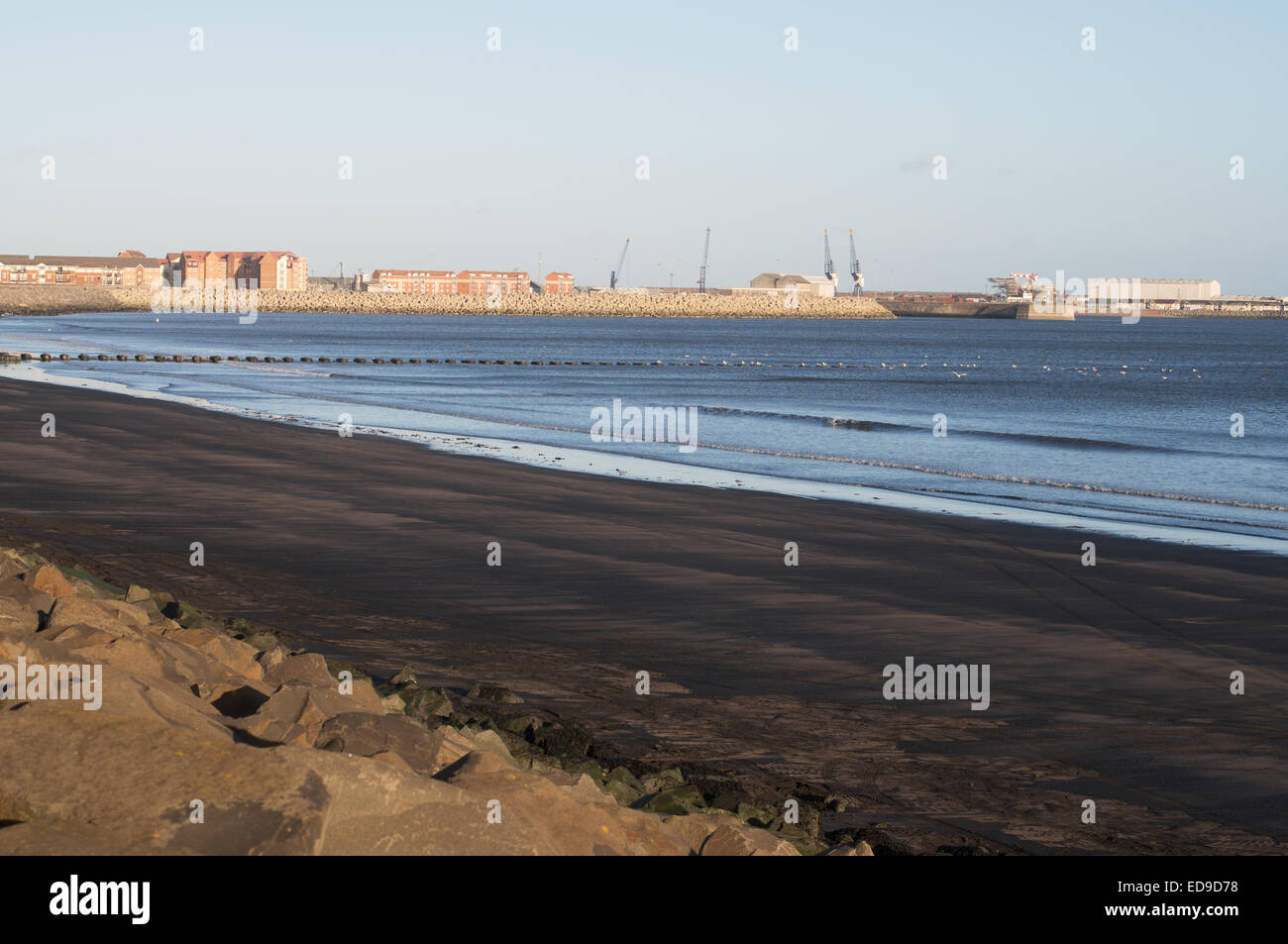 Beach covered in coal dust, Hartlepool, north east England, UK Stock ...