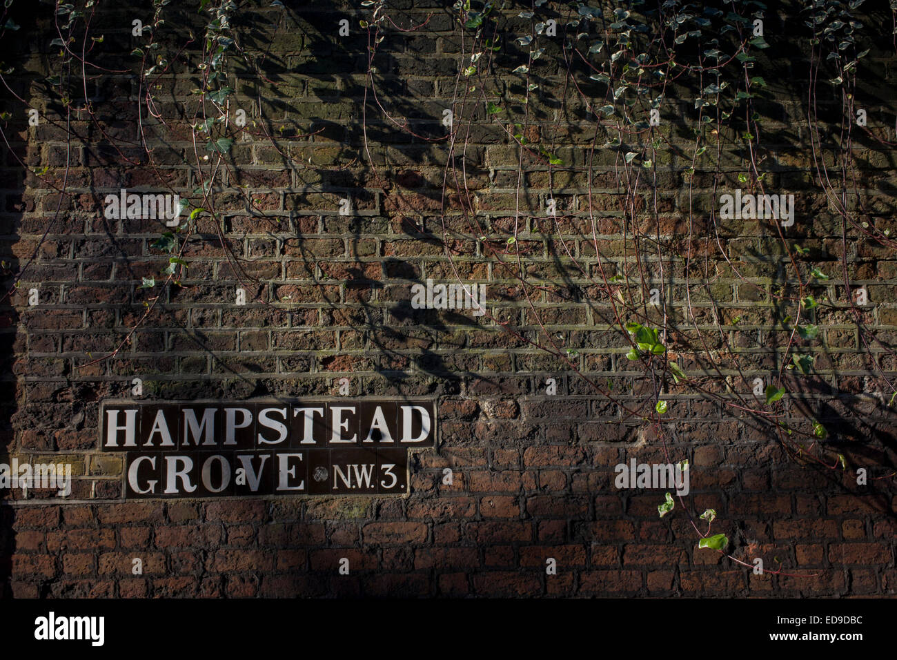 Detail of brick wall with Hampstead Grove NW3 road sign Stock Photo - Alamy