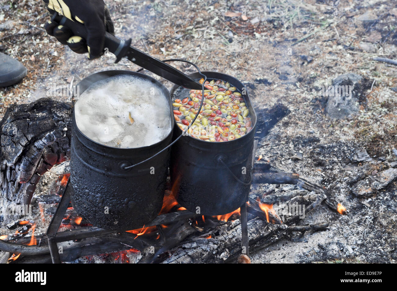 Cooking on a fire. Cooking in field conditions spur the imagination of ...