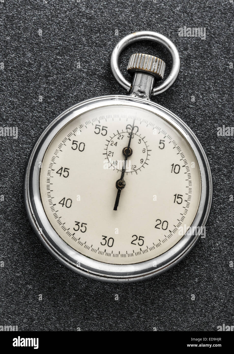 Single stopwatch in closeup on gray background Stock Photo - Alamy