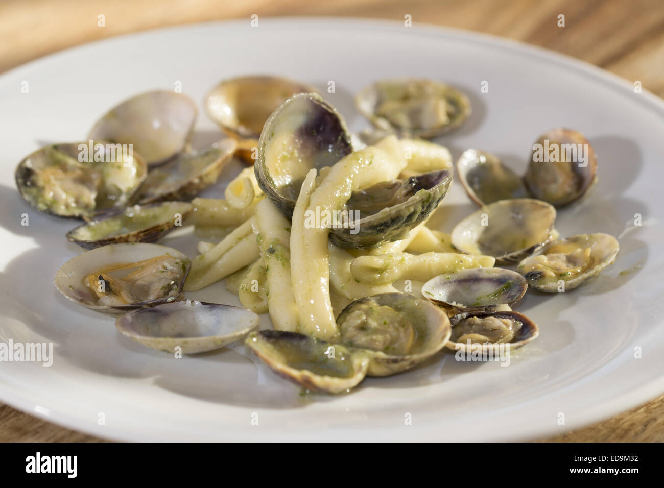 typical and traditional mediterranean dish of fish: pasta at the clams ...