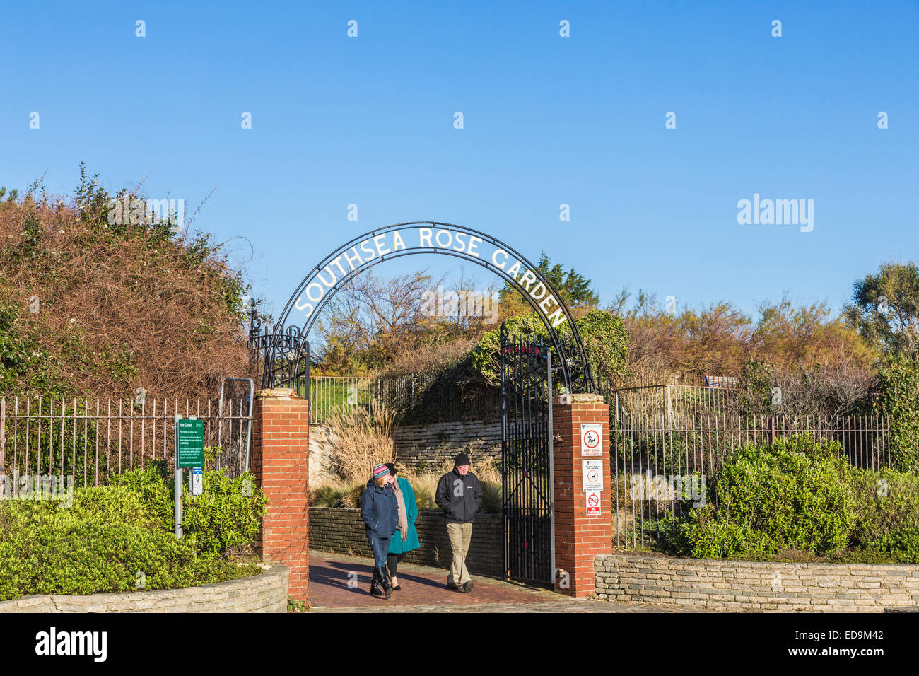 Entrance arch sign at Southsea Rose Garden against a blue sky, Southsea ...