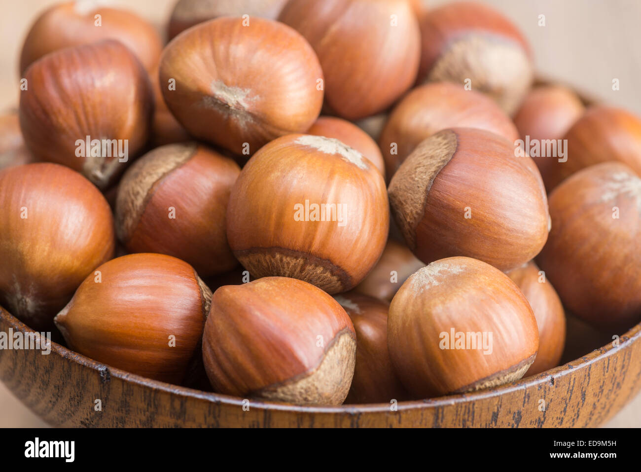 hazelnuts in shell in a wooden bowl Stock Photo - Alamy