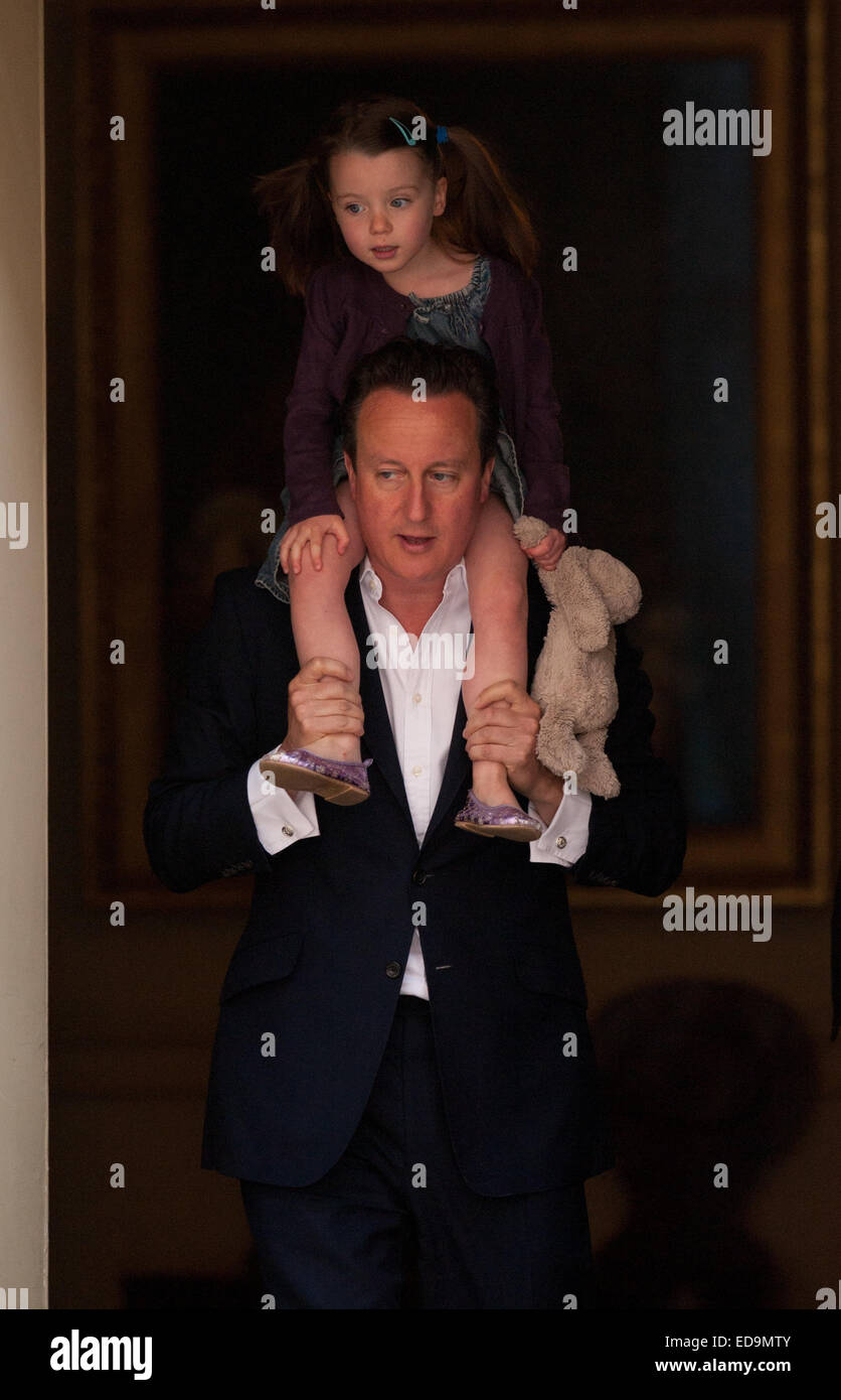 David Cameron leaves Downing Street carrying his daughter Florence ...