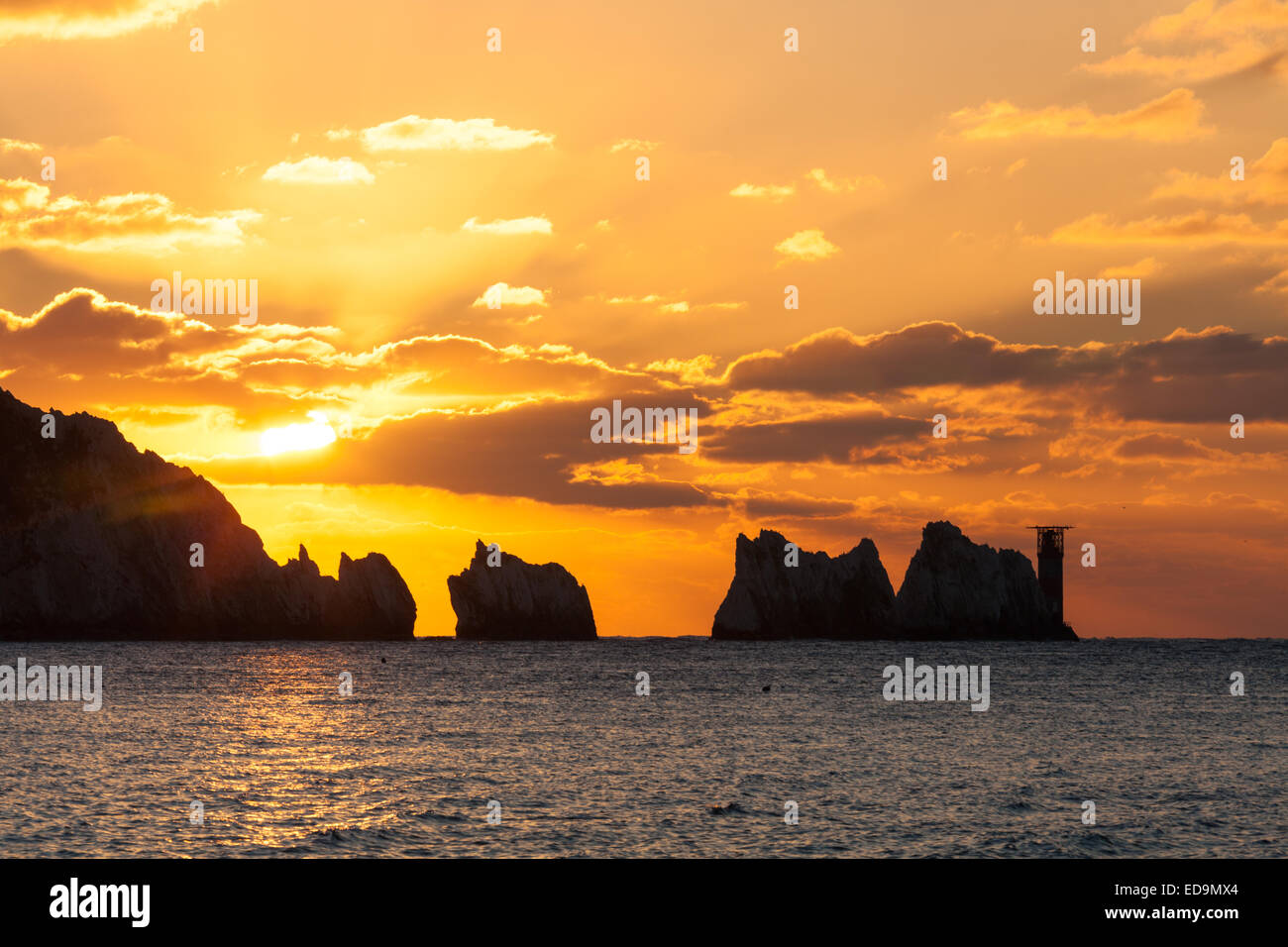 The Needles lighthouse at sunset Stock Photo - Alamy