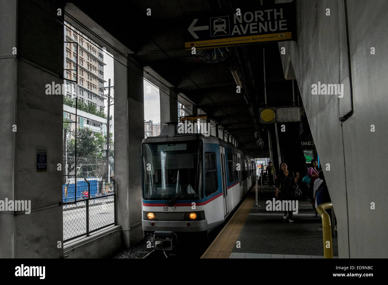 A north bound MRT train approaches Boni - Edsa station on a vacation ...